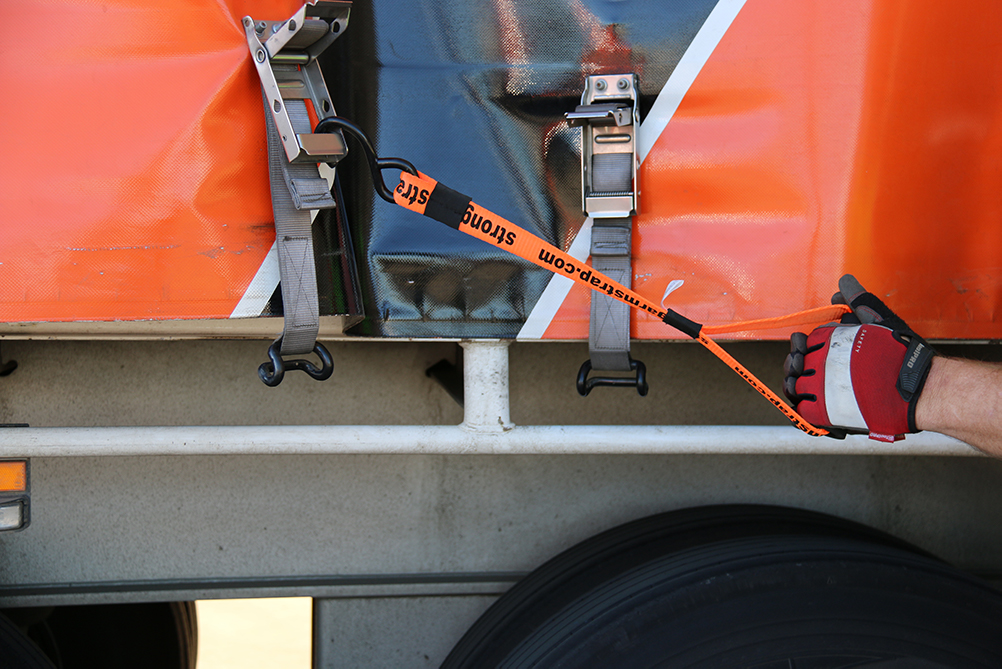 Ingenious strap preventing injuries in trucking industry